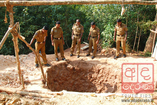 Two nabbed digging for treasure near temple in Puttalam
