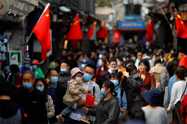 China announces three-child policy to boost falling birth rate