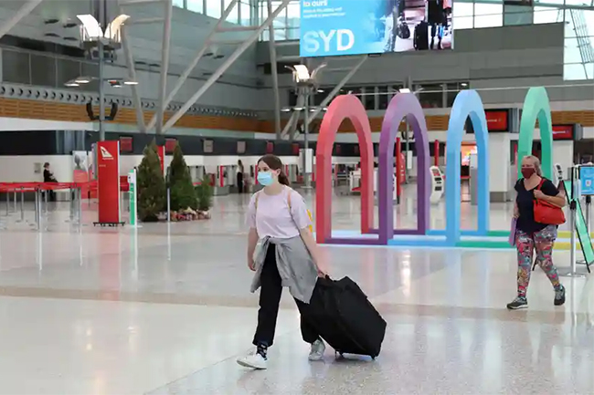 Australia to ease border ban on some foreign citizens