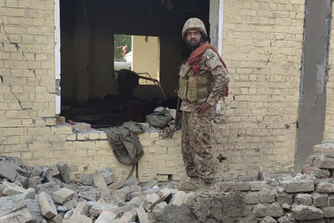 Suicide bomber attacks police station in northwest Pakistan, killing 22 ...