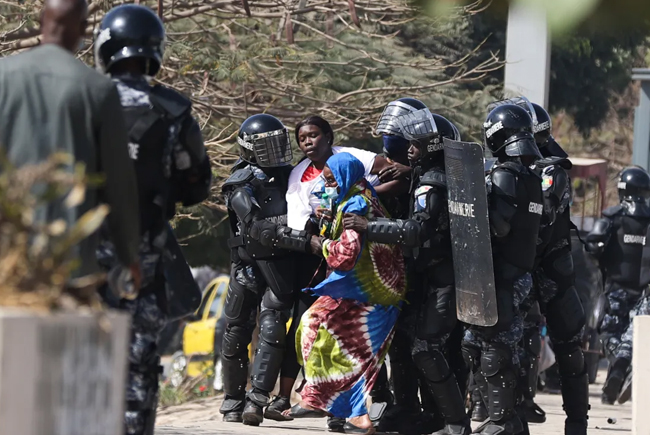 Police and protesters clash after Senegal election postponed